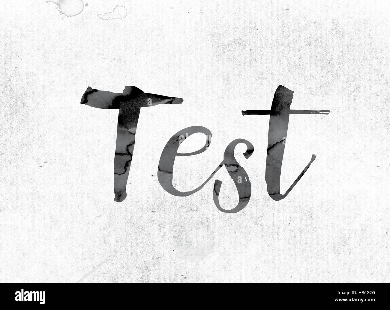 The word "Test" concept and theme painted in watercolor ink on a white ...