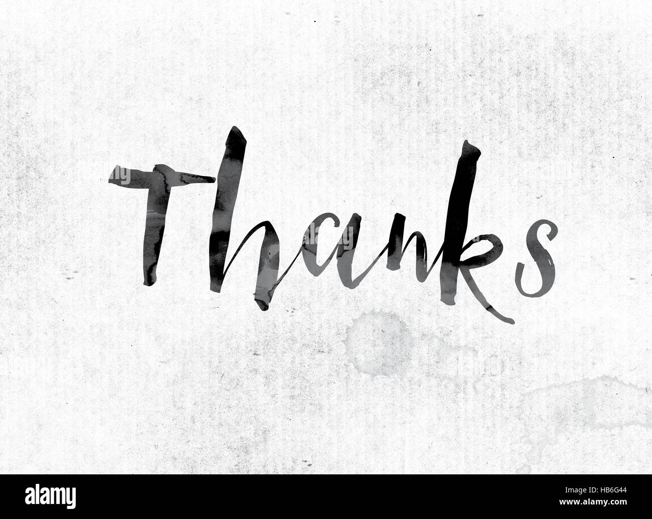 The word "Thanks" concept and theme painted in watercolor ink on a ...