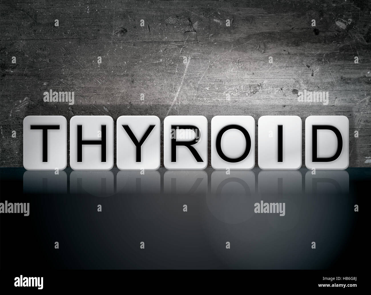 The word "Thyroid" written in white tiles against a dark vintage grunge ...