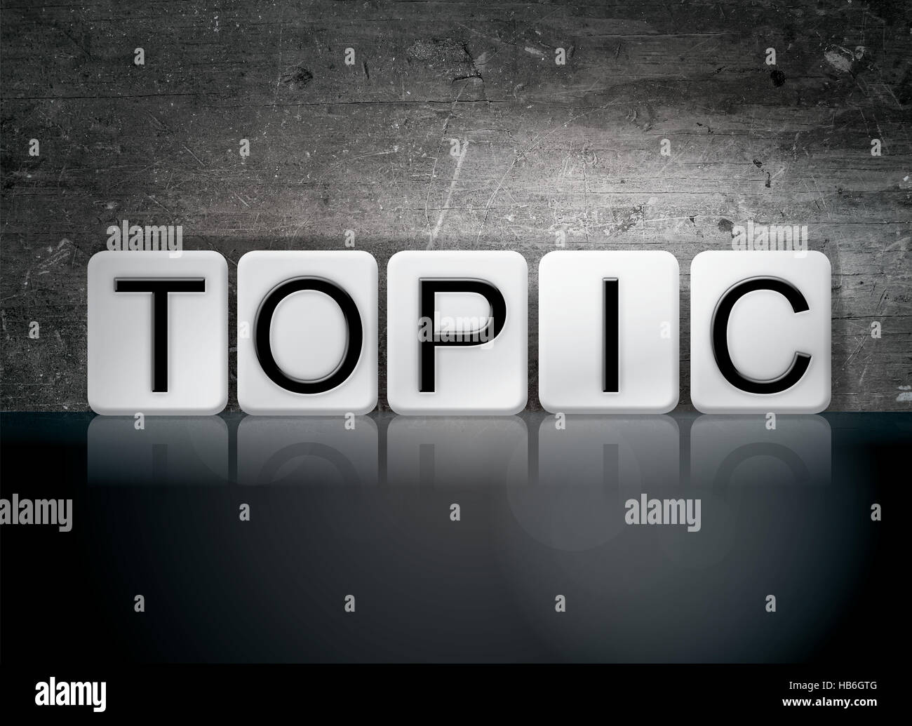 The word "Topic" written in white tiles against a dark vintage grunge ...