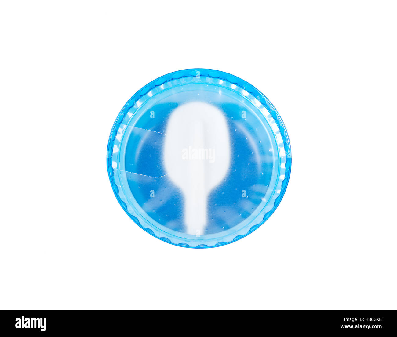 disposable plastic spoon in yogurt cap Stock Photo - Alamy