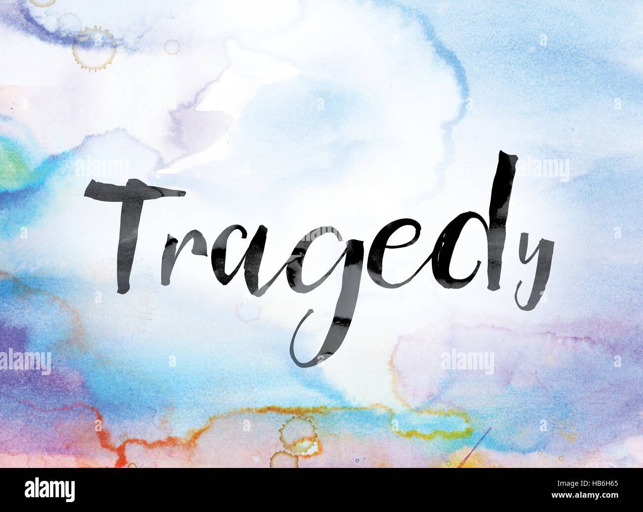 The word "Tragedy" painted in black ink over a colorful watercolor ...