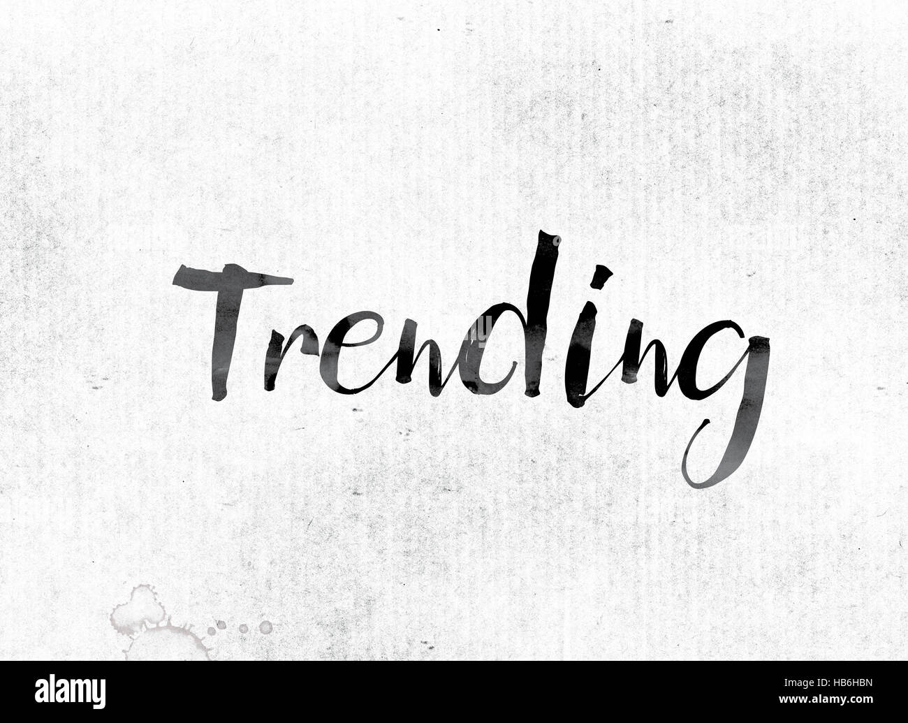 The word "Trending" concept and theme painted in watercolor ink on a ...