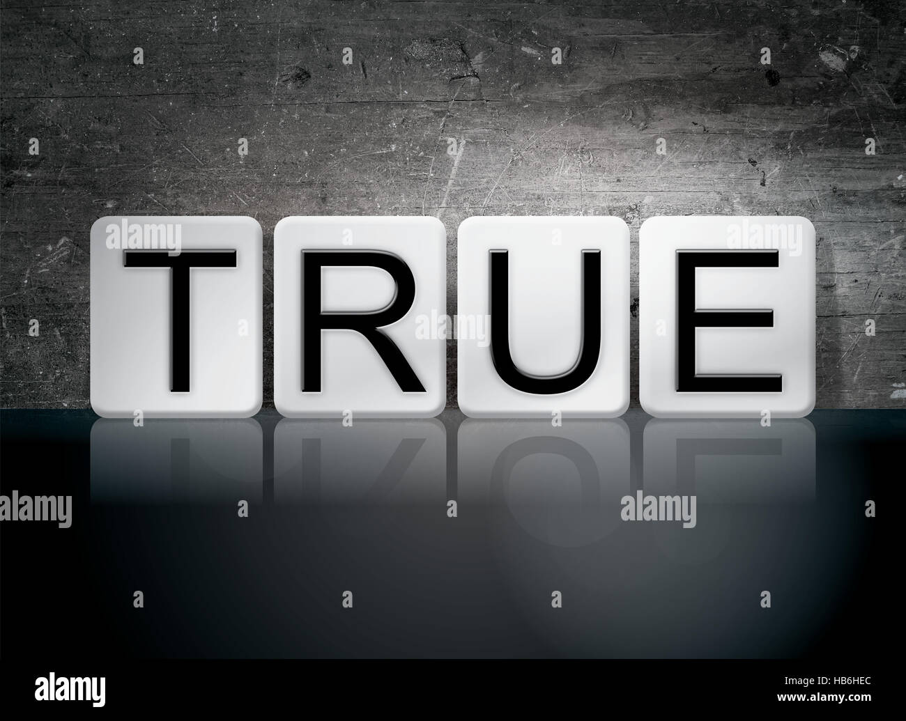 The word "True" written in white tiles against a dark vintage grunge ...