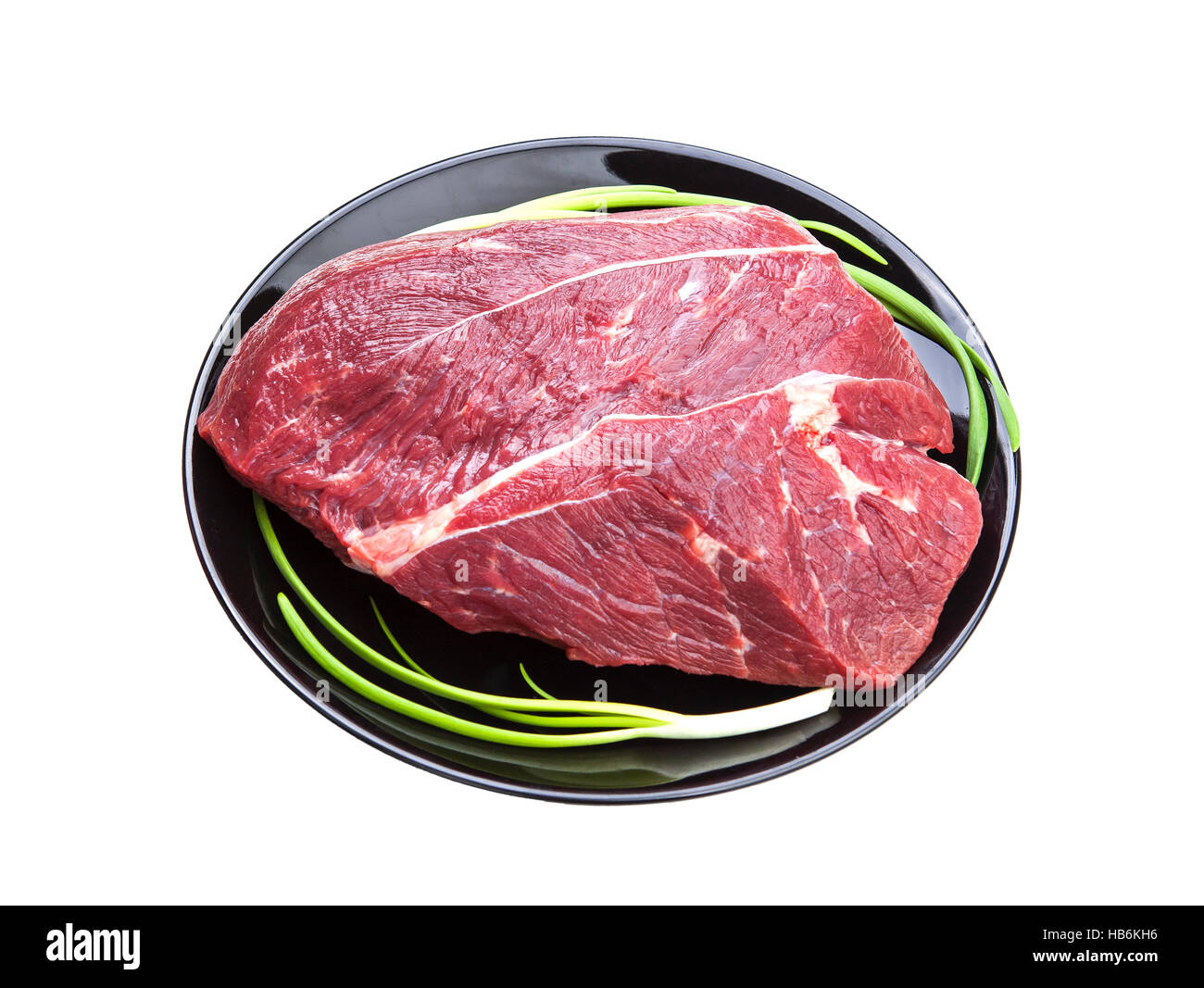 Piece of raw beef isolated on white background Stock Photo - Alamy