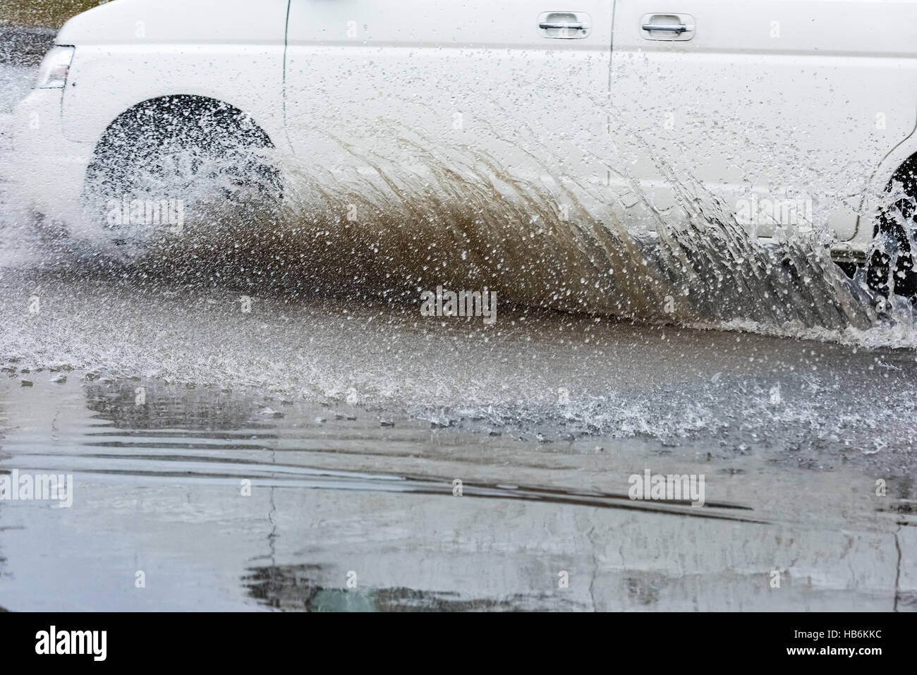 car rain puddle splashing water Stock Photo - Alamy