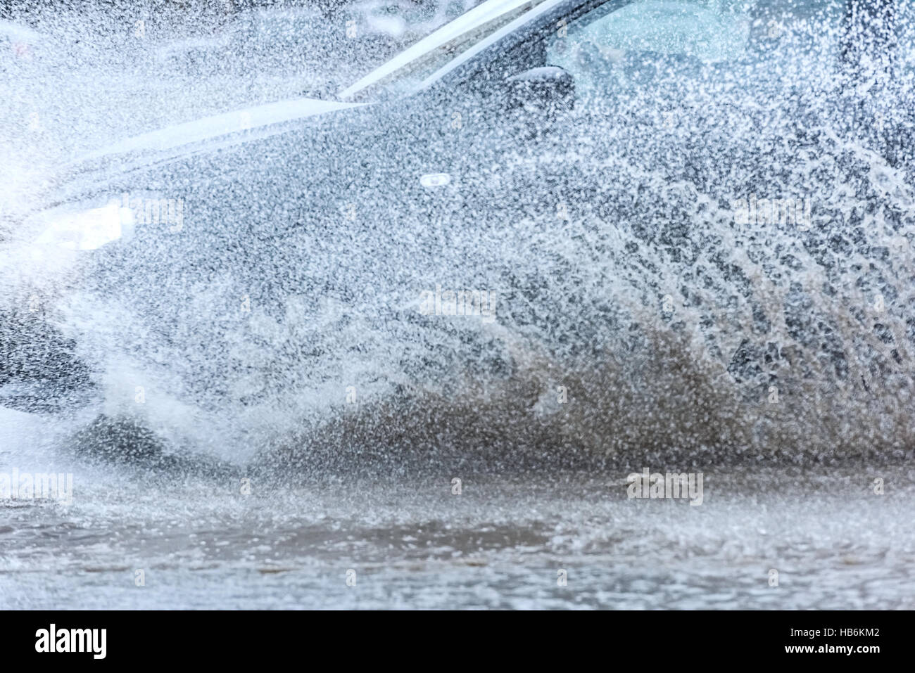 car rain puddle splashing water Stock Photo - Alamy