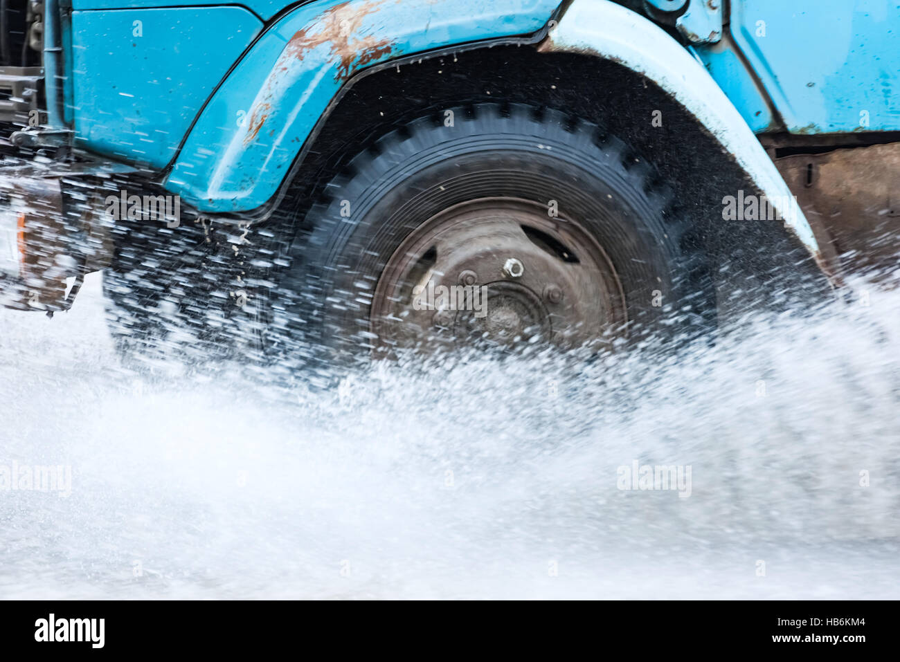 car rain puddle splashing water Stock Photo - Alamy