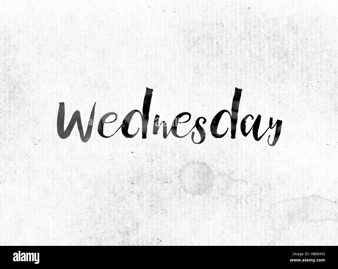 The word "Wednesday" concept and theme painted in watercolor ink on a ...
