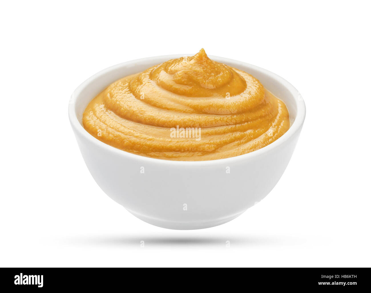 Mustard in bowl isolated on white background Stock Photo - Alamy