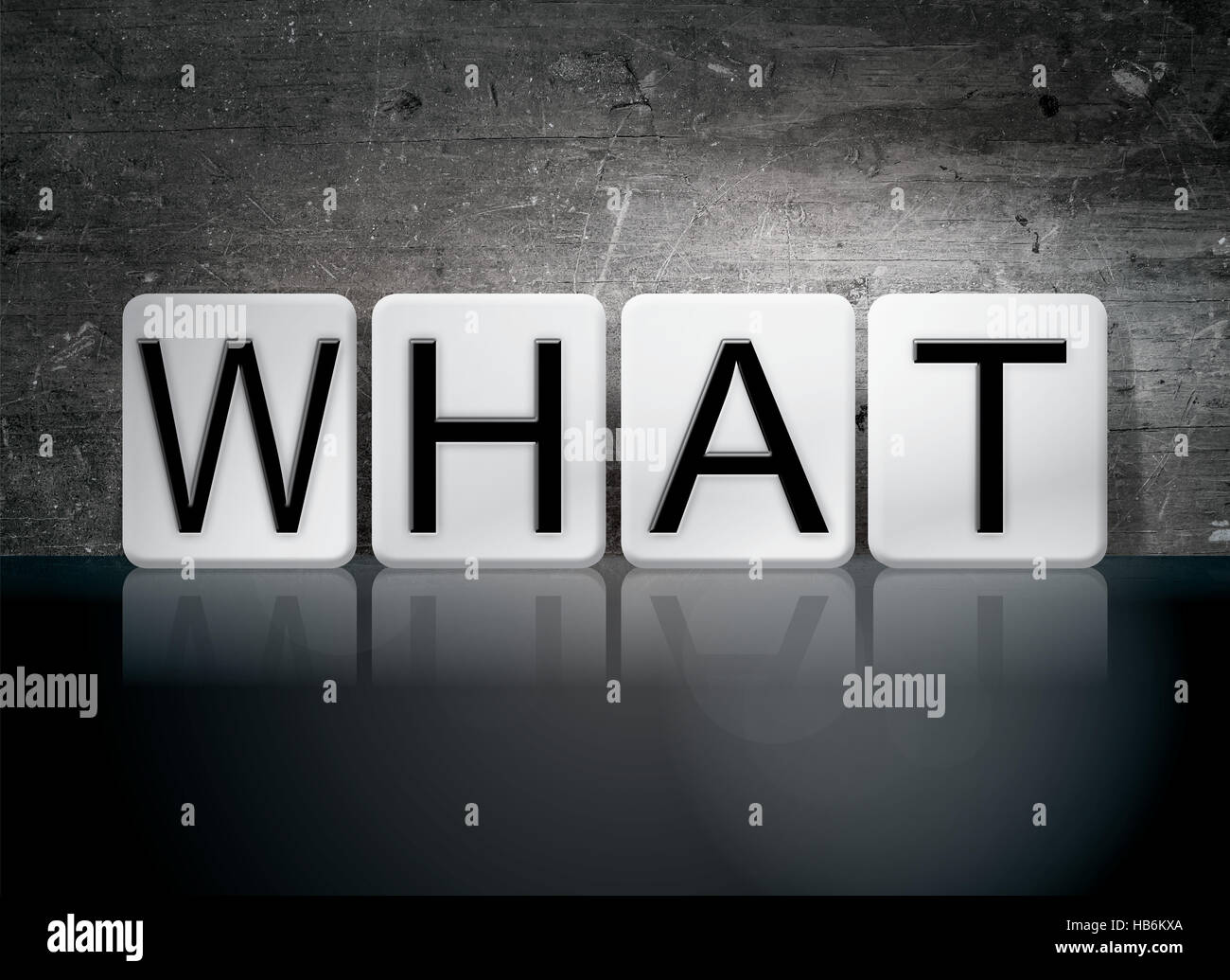 The word "What" written in white tiles against a dark vintage grunge ...