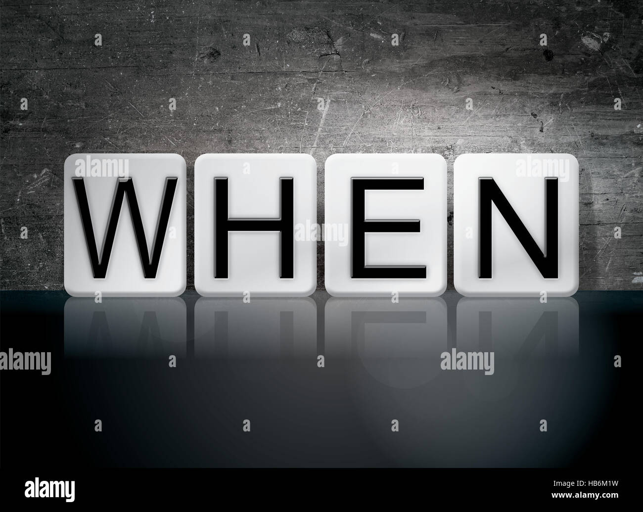 The word "When" written in white tiles against a dark vintage grunge ...
