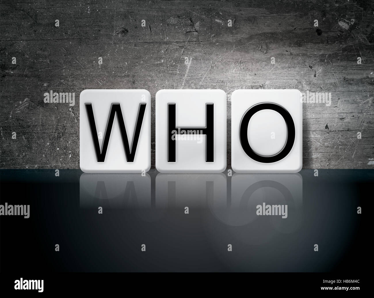 The word "Who" written in white tiles against a dark vintage grunge ...