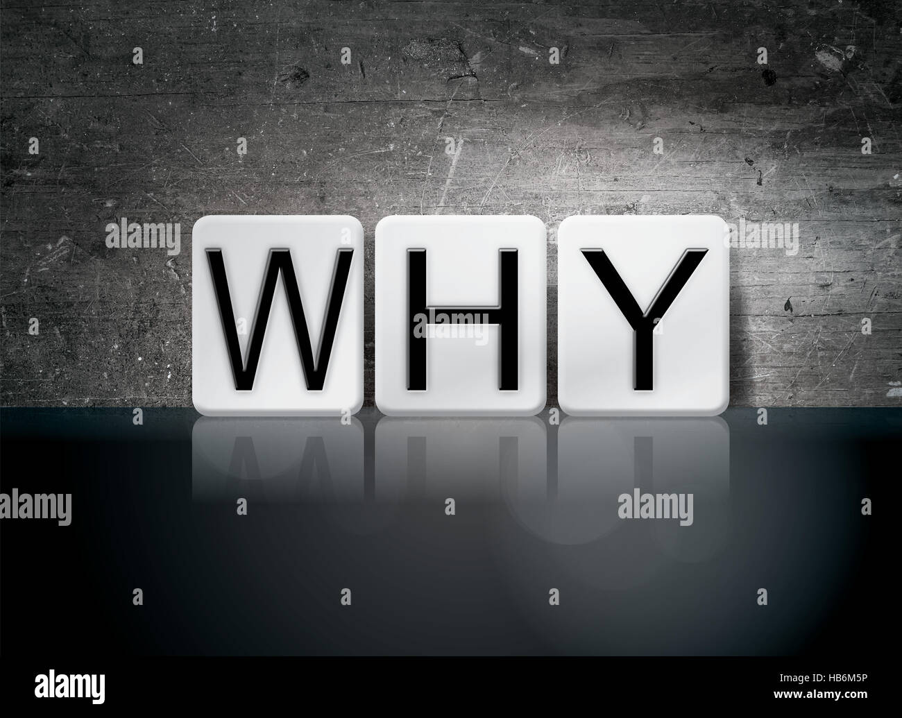The word "Why" written in white tiles against a dark vintage grunge ...