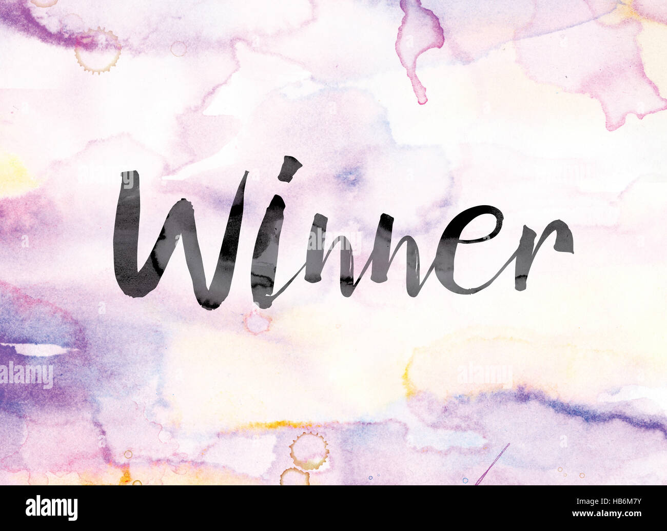 The word "Winner" painted in black ink over a colorful watercolor ...