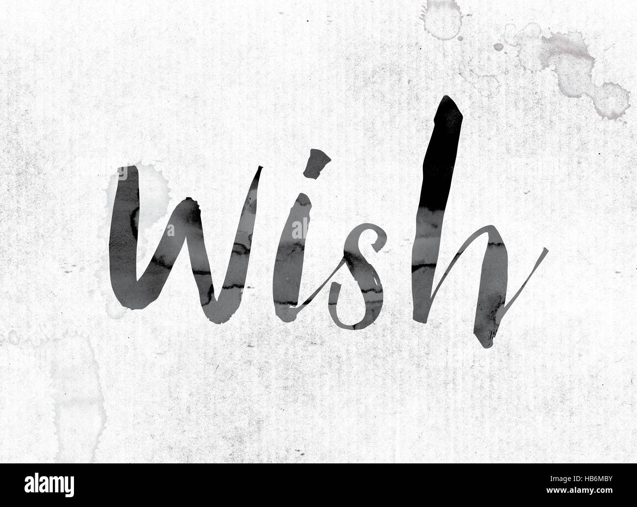 The word "Wish" concept and theme painted in watercolor ink on a white ...