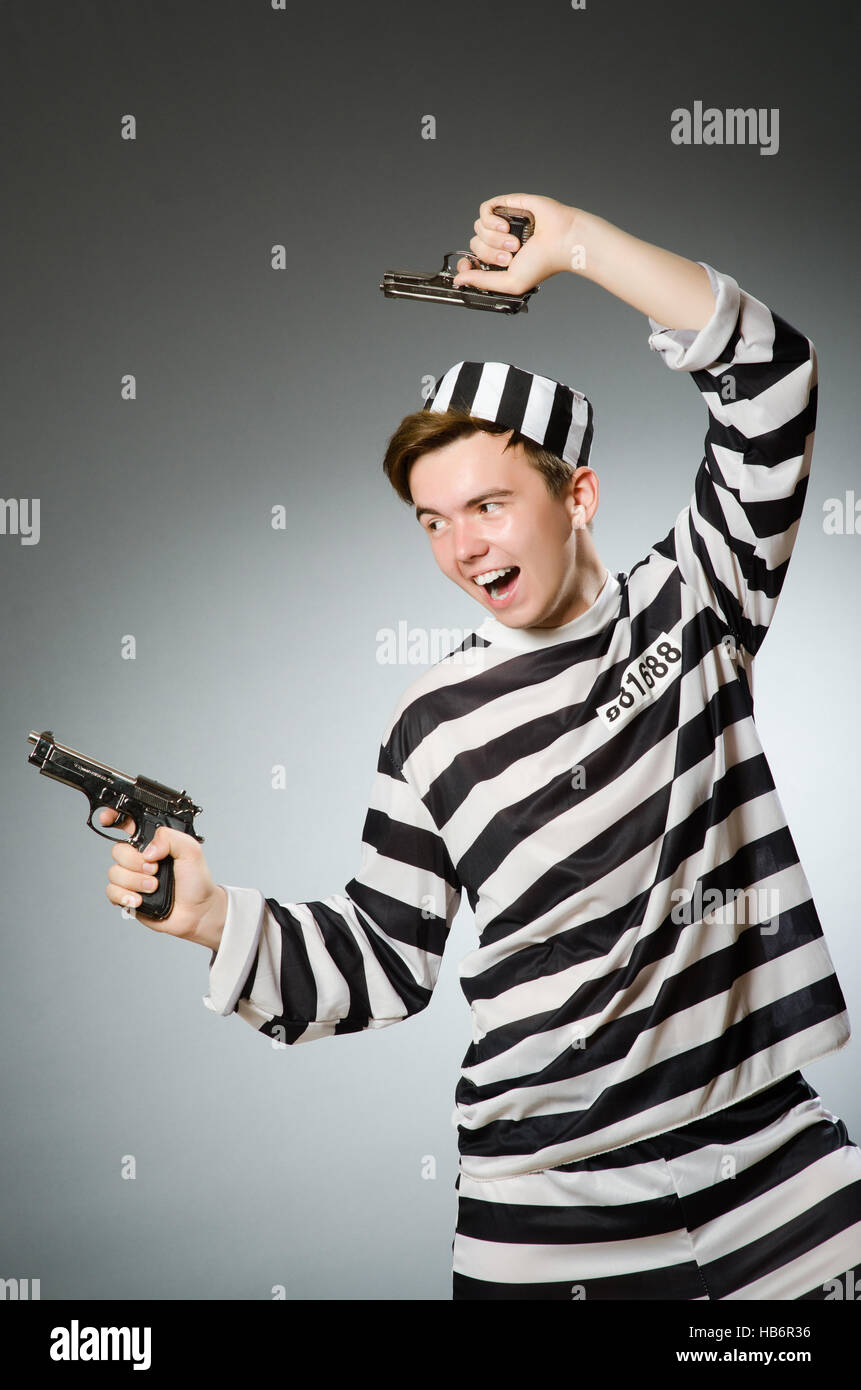 Funny prisoner in prison concept Stock Photo - Alamy