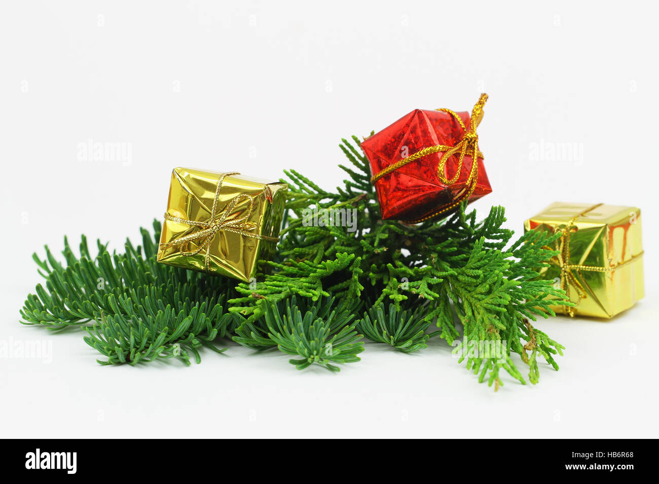 Miniature red and golden gift boxes on fresh pine with copy space Stock ...