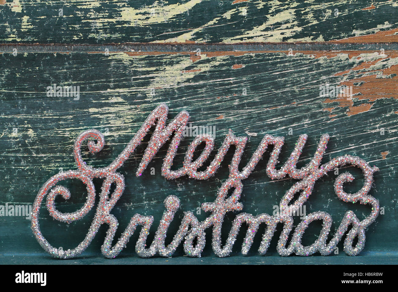 Silver Merry Christmas sign on rustic wooden surface Stock Photo - Alamy