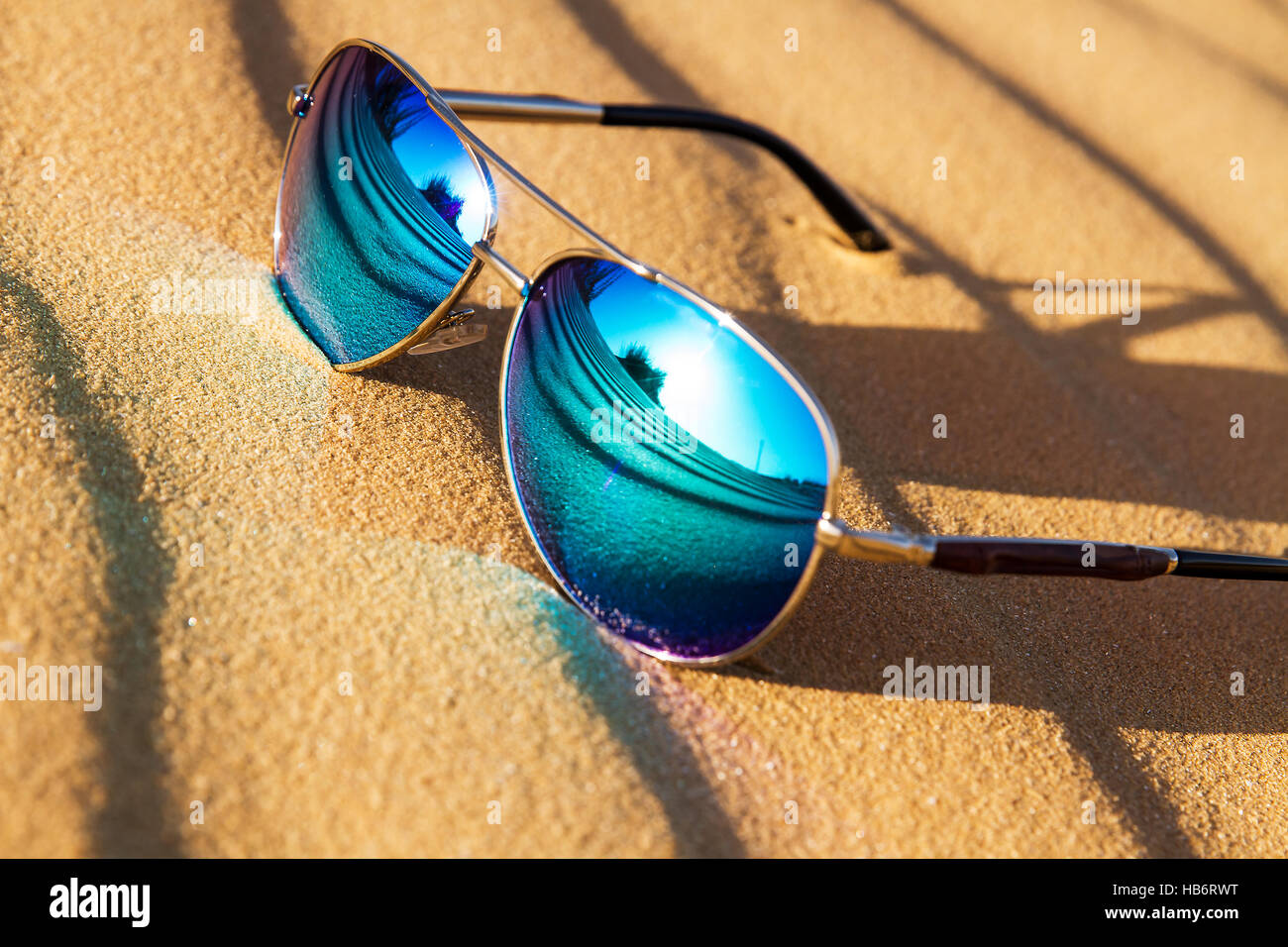 Sunglasses on the sand in the desert Stock Photo - Alamy