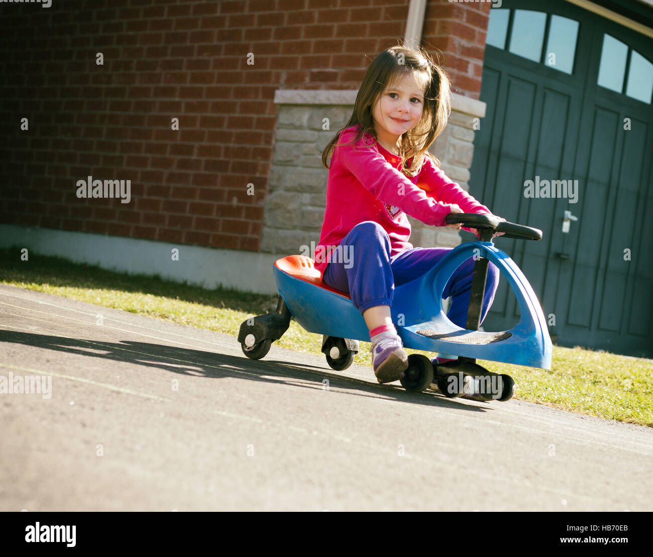 girl riding scooter Stock Photo - Alamy