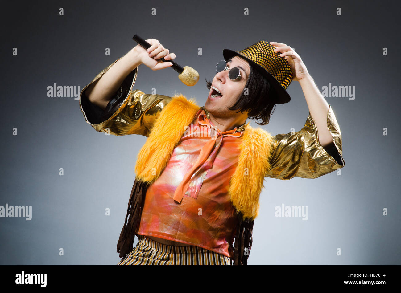 Young man singing in karaoke club Stock Photo - Alamy