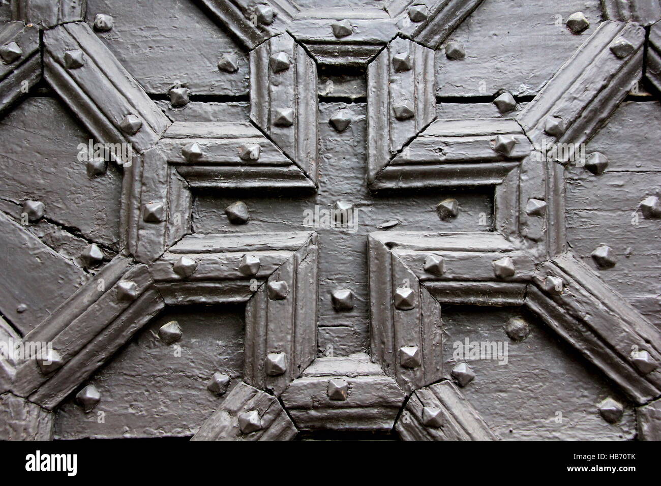 Grey wooden background with spikes and a cross Stock Photo - Alamy