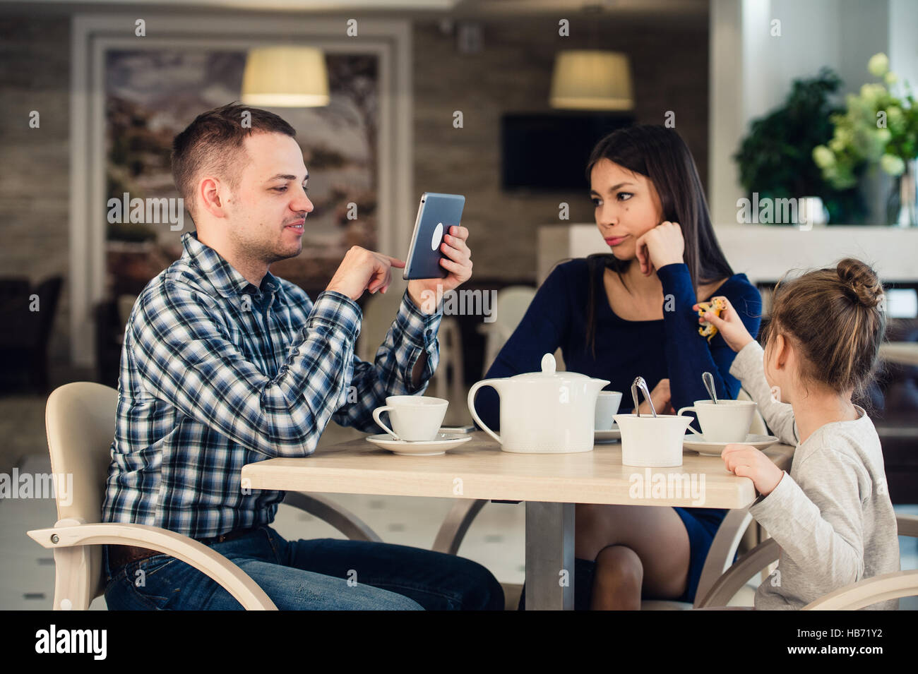 Modern family values. Father addicted about using electronic devices ...