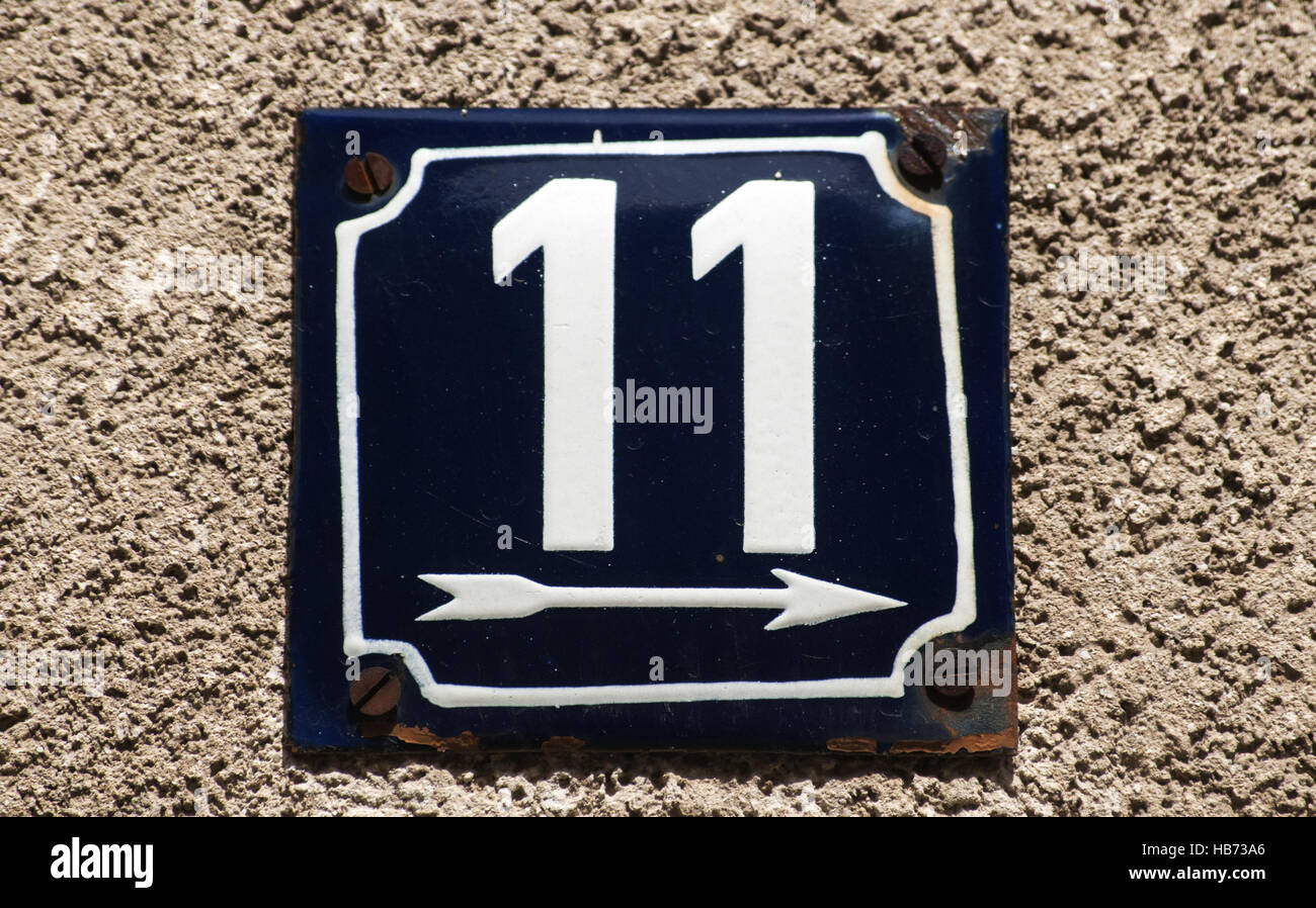 Weathered enameled plate number 11 Stock Photo - Alamy