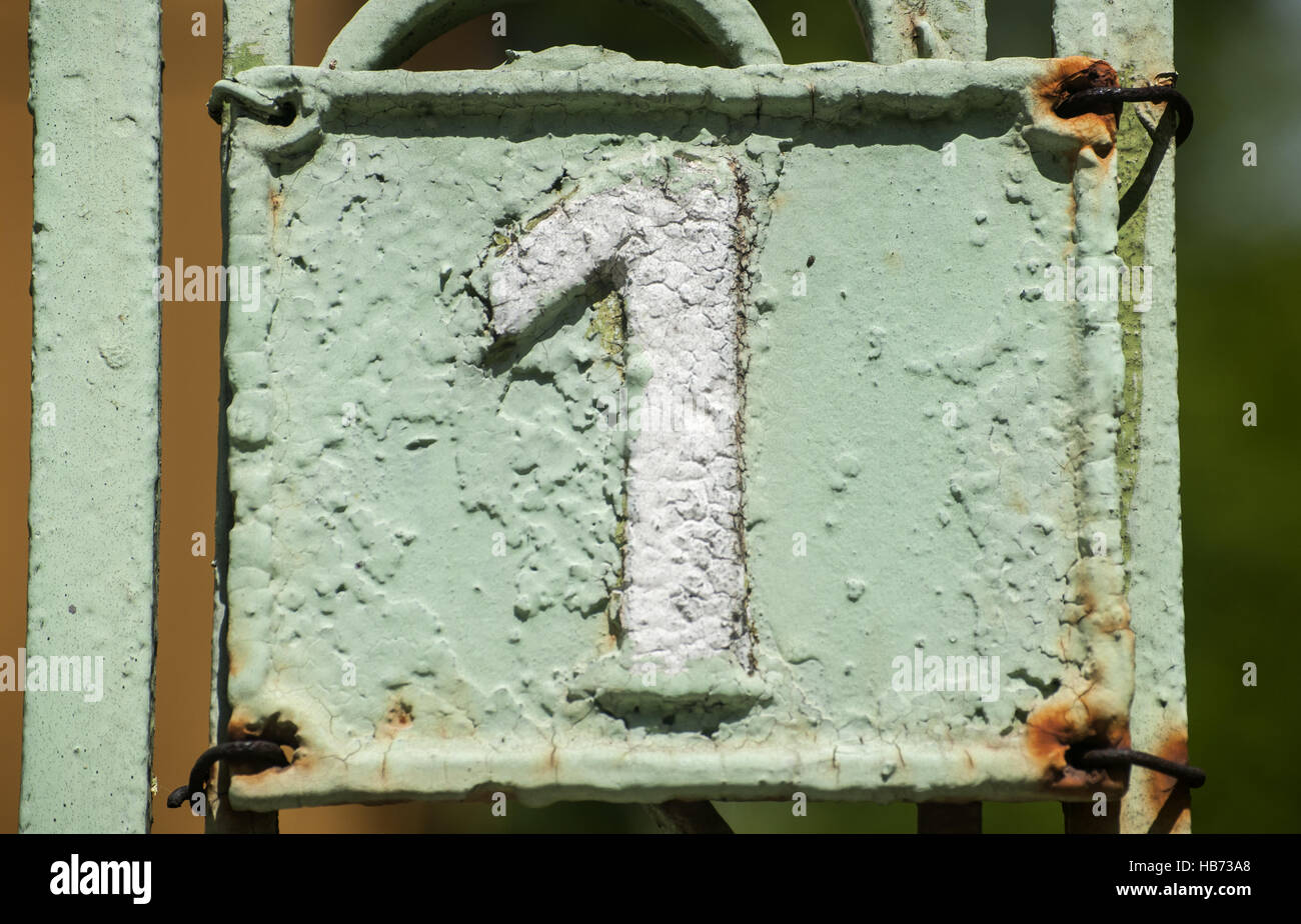 Old retro cast iron plate number 1 Stock Photo - Alamy