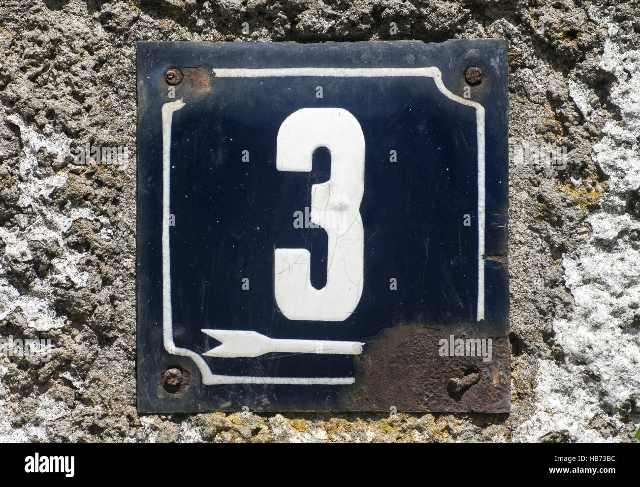 Weathered enameled plate number 3 Stock Photo - Alamy