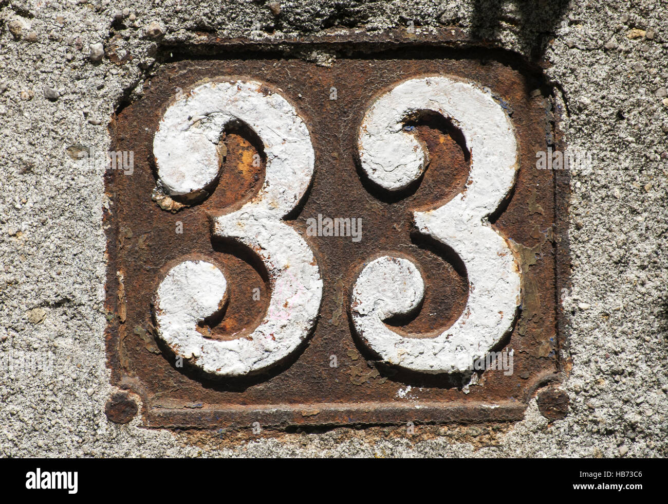 Old retro cast iron plate number 33 Stock Photo - Alamy