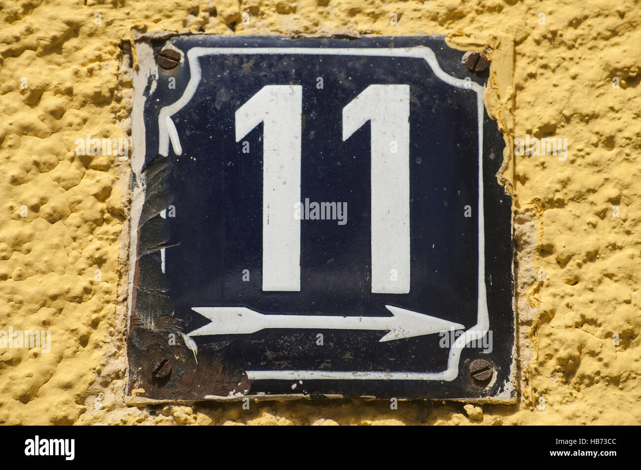 Weathered enameled plate number 11 Stock Photo - Alamy