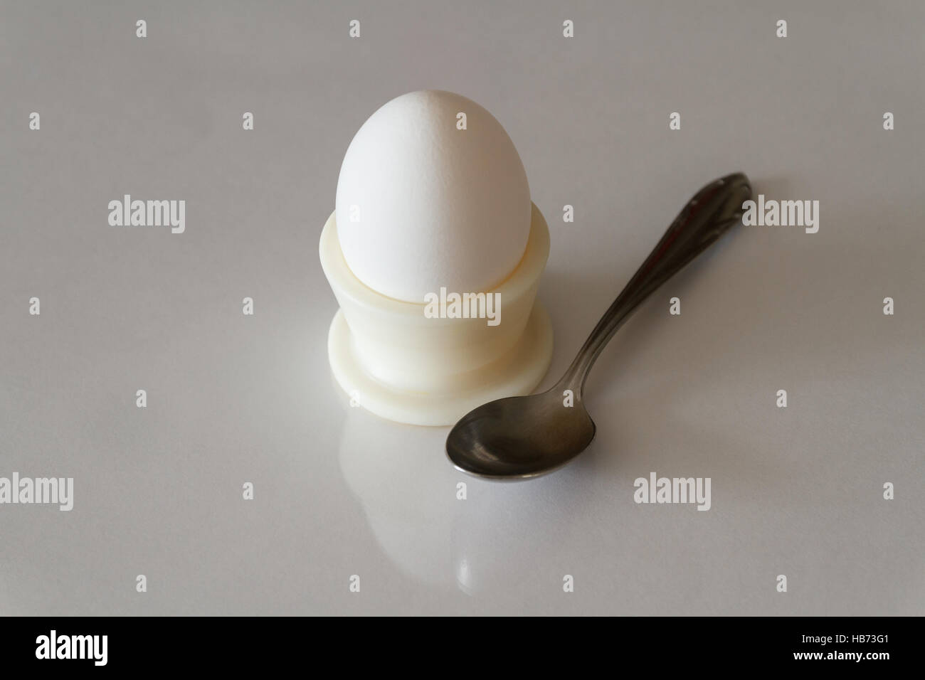Boiled egg with spoon Stock Photo - Alamy