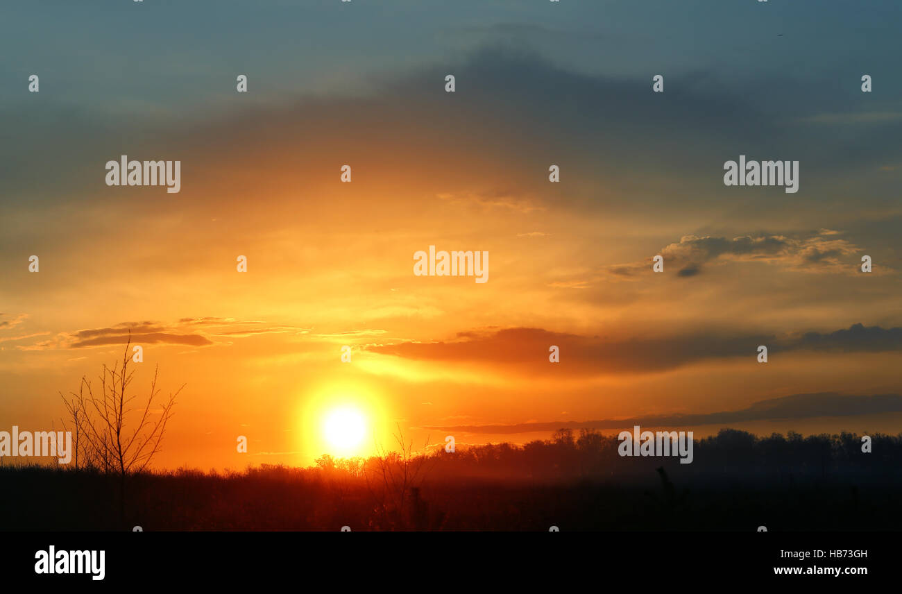 Photos landscape beautiful bright sunset over the field Stock Photo - Alamy