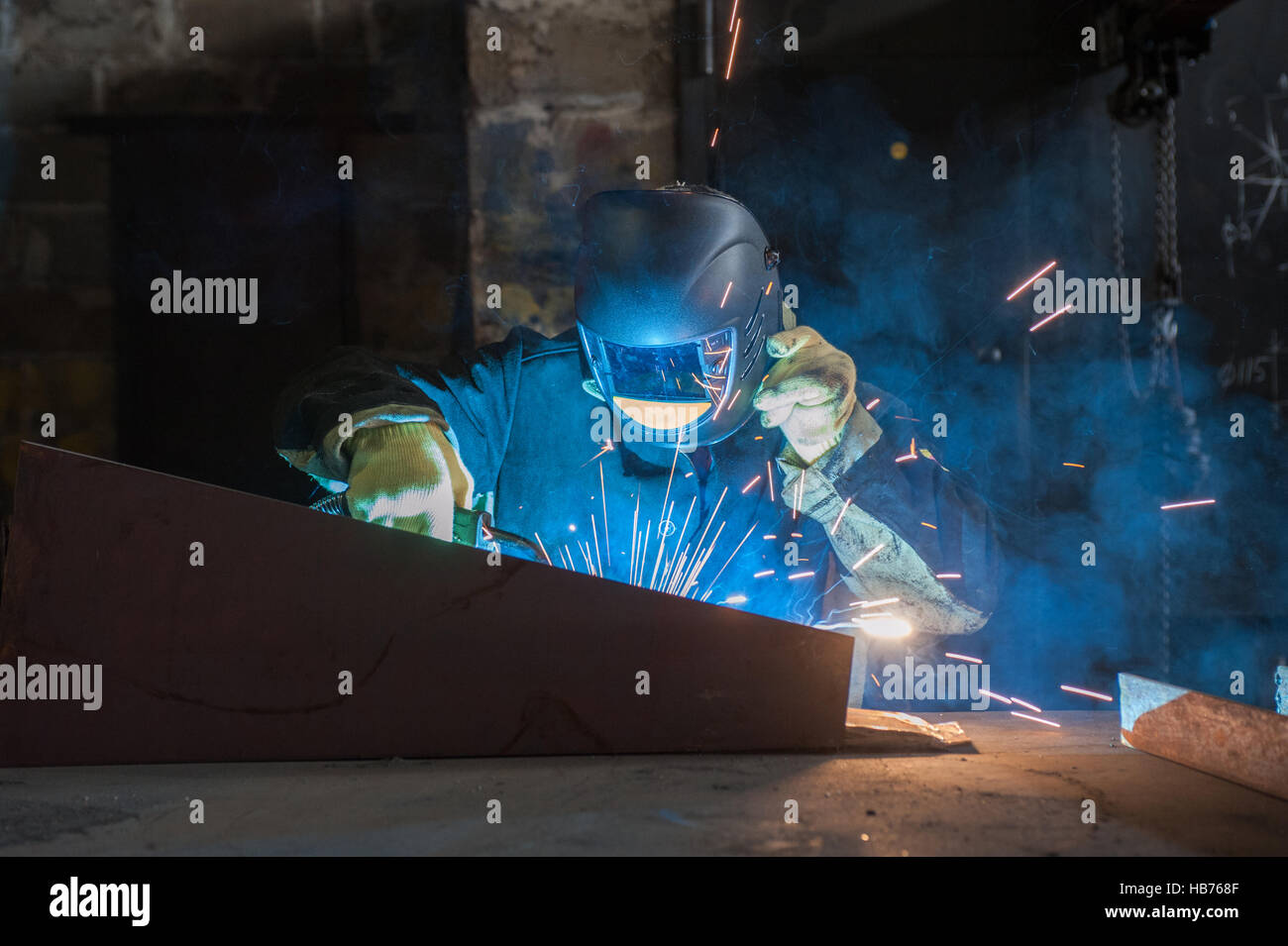 worker welding metal Stock Photo - Alamy