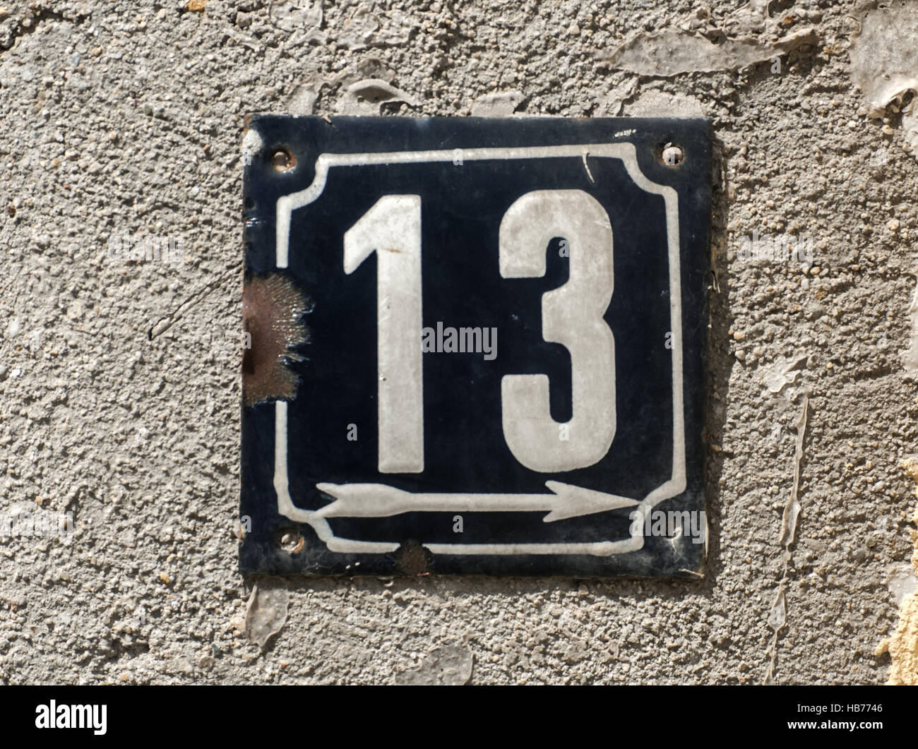 Weathered enameled plate number 13 Stock Photo - Alamy