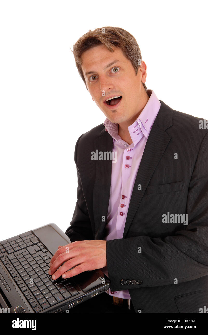 Surprised man looking at laptop hi-res stock photography and images - Alamy