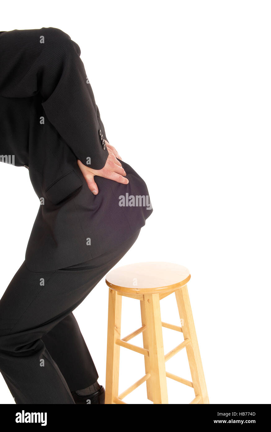 Businessman with back pain Stock Photo - Alamy