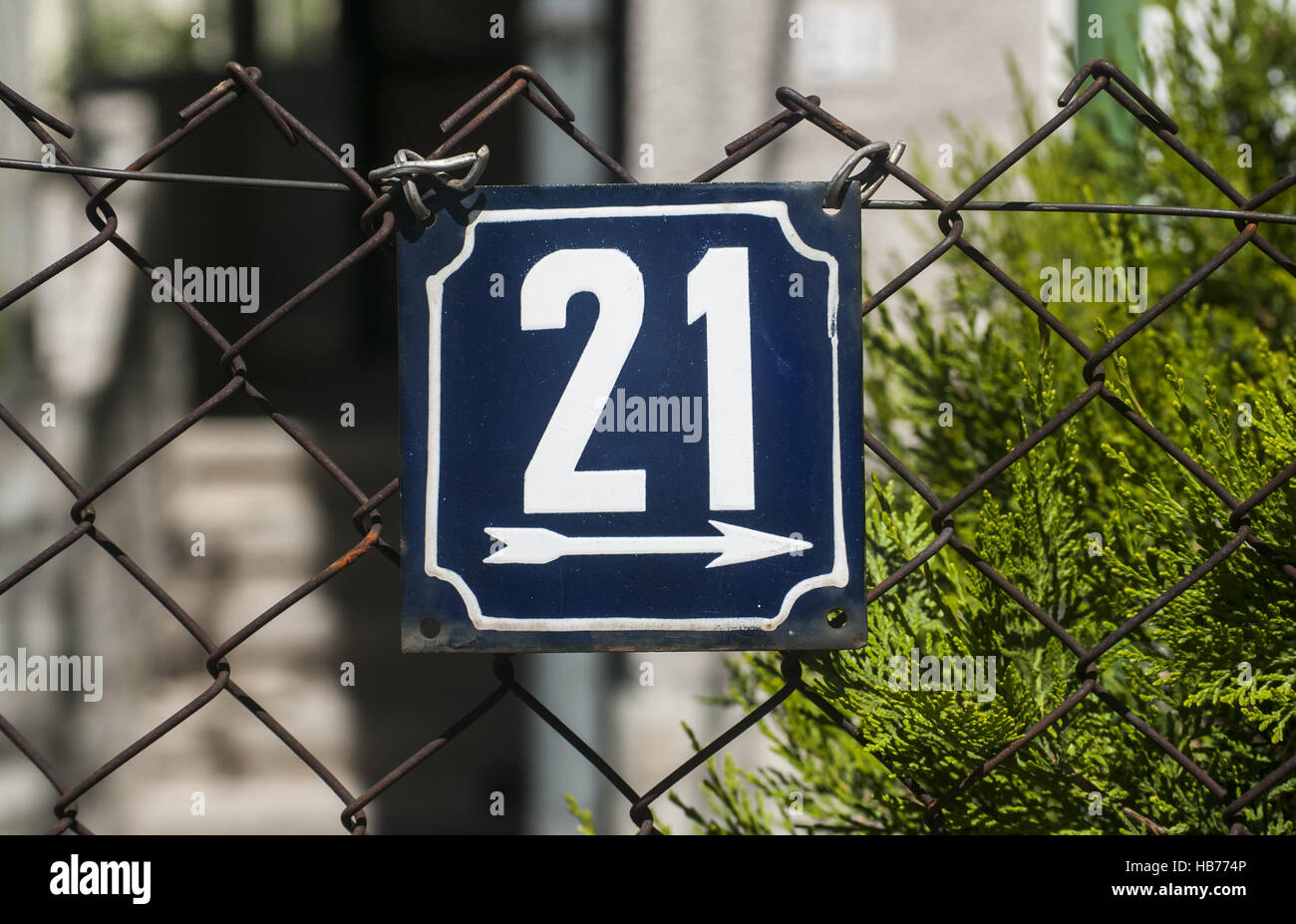 Weathered enameled plate number 21 Stock Photo - Alamy