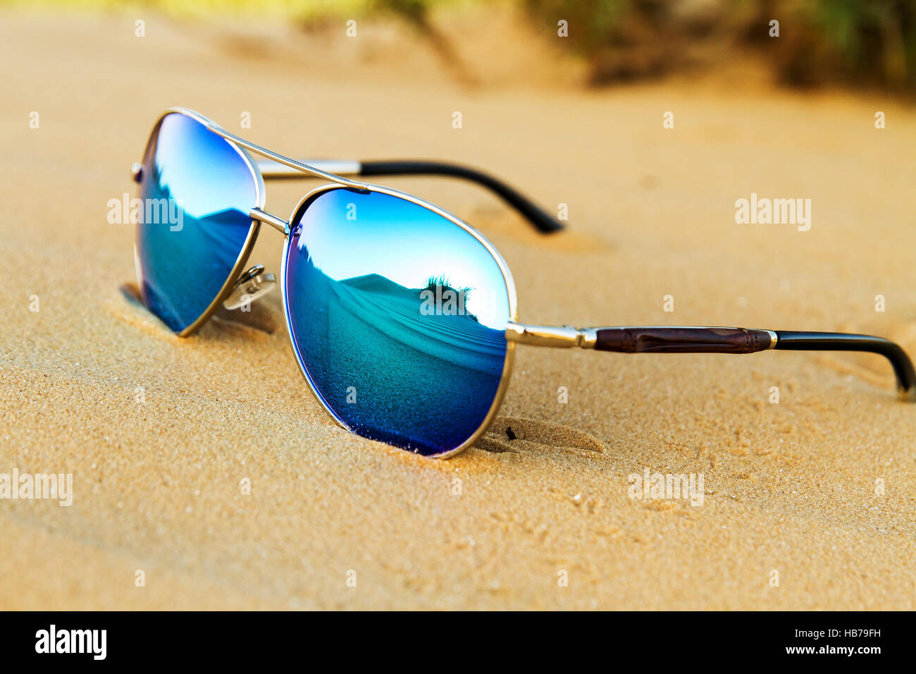 Sunglasses on the sand in the desert Stock Photo - Alamy