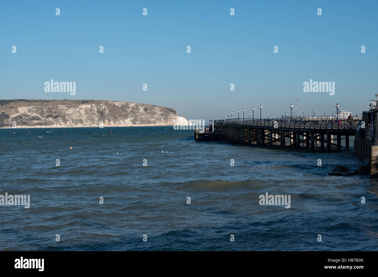 Swanage Pier, with Ballard Cliffs and the Pinnacles in the distance ...