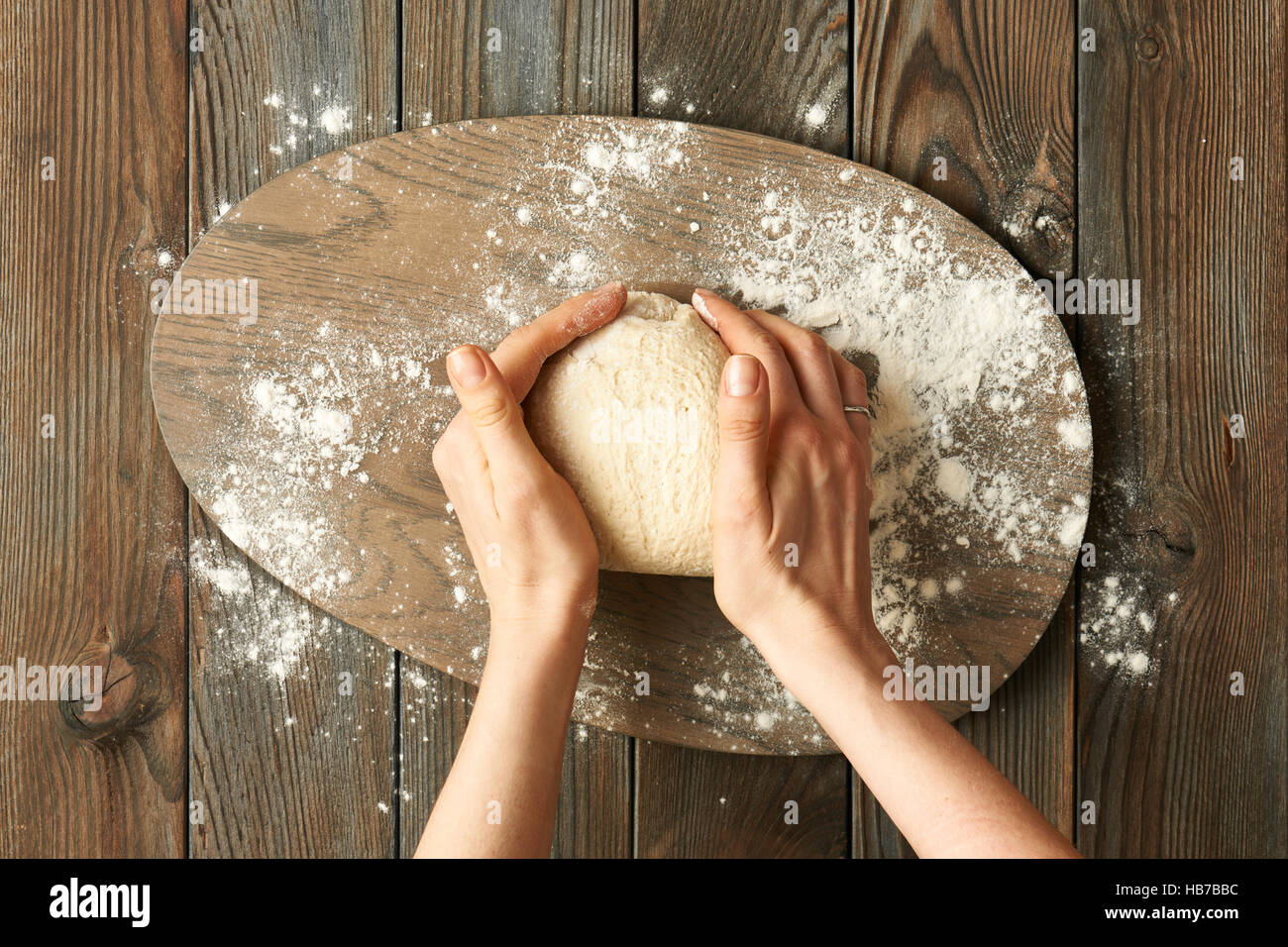 Female hands kneading dough Stock Photo - Alamy