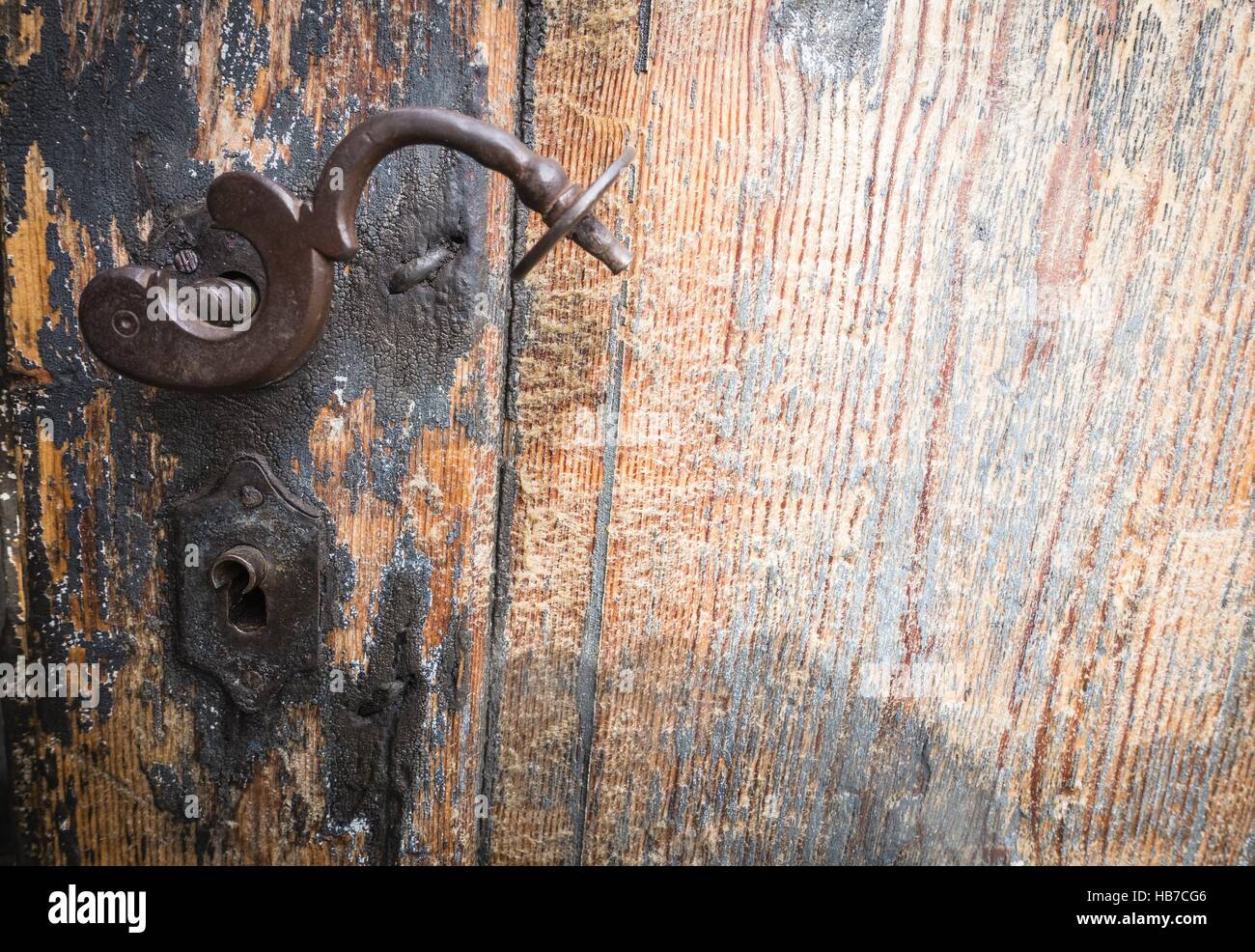 rusty door handle on an old door Stock Photo - Alamy