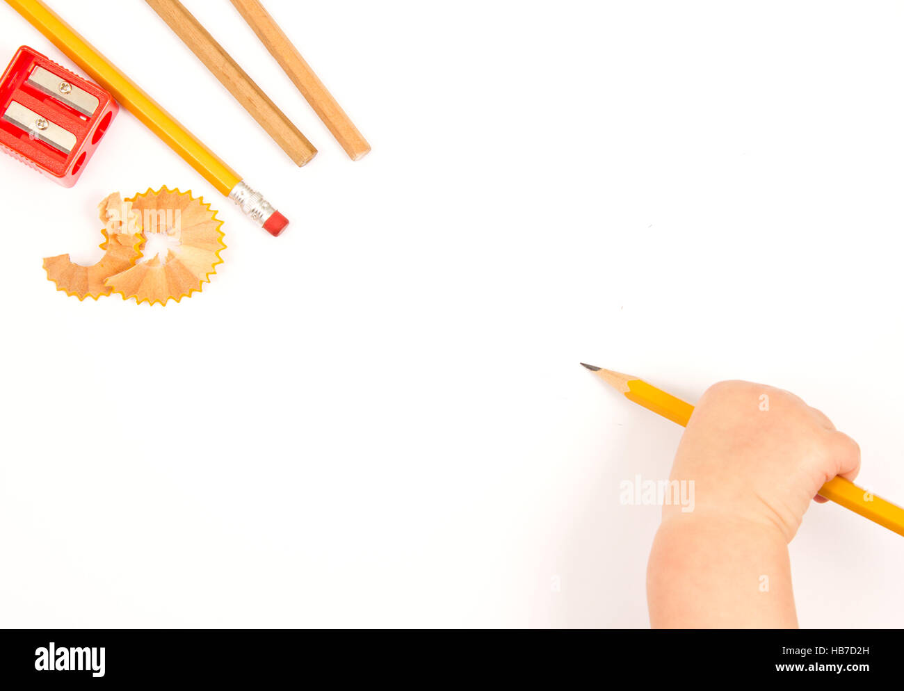 a baby's hand prepared for drawing on a white sheet of paper Stock ...