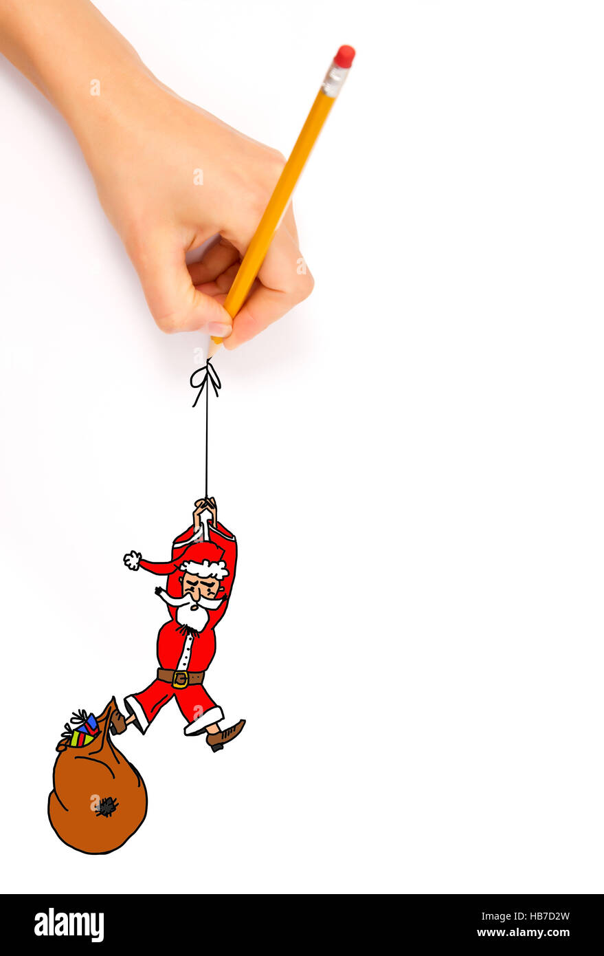 a hand is drawing a Santa Claus on a white sheet of paper Stock Photo ...