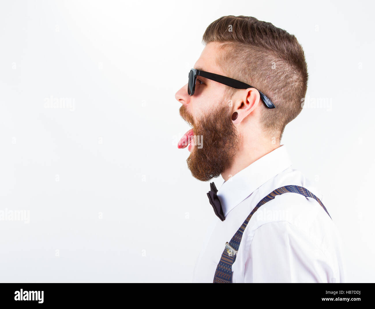 Man tongue out profile hi-res stock photography and images - Alamy