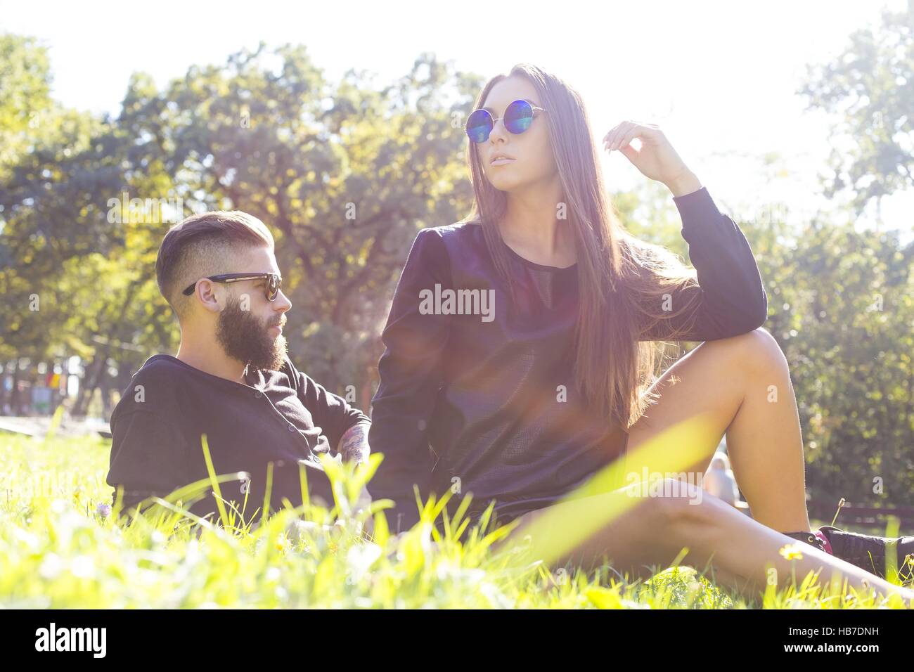 Young happy lovers spending time together outdoors Stock Photo - Alamy