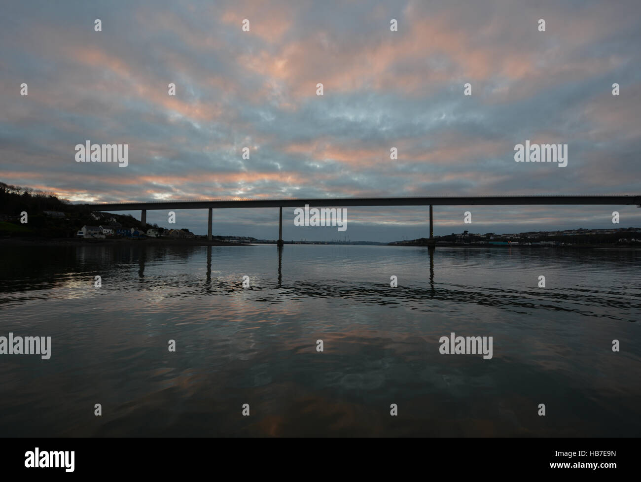 The Cleddau bridge at Pembroke Dock silhouetted against the pink and ...