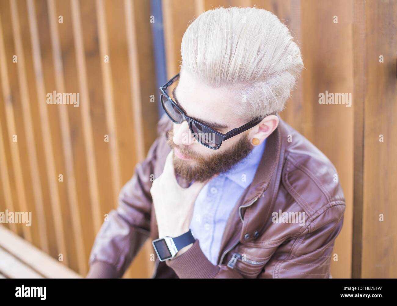 Stylish young hipster guy showing off with cool hand gestures Stock ...